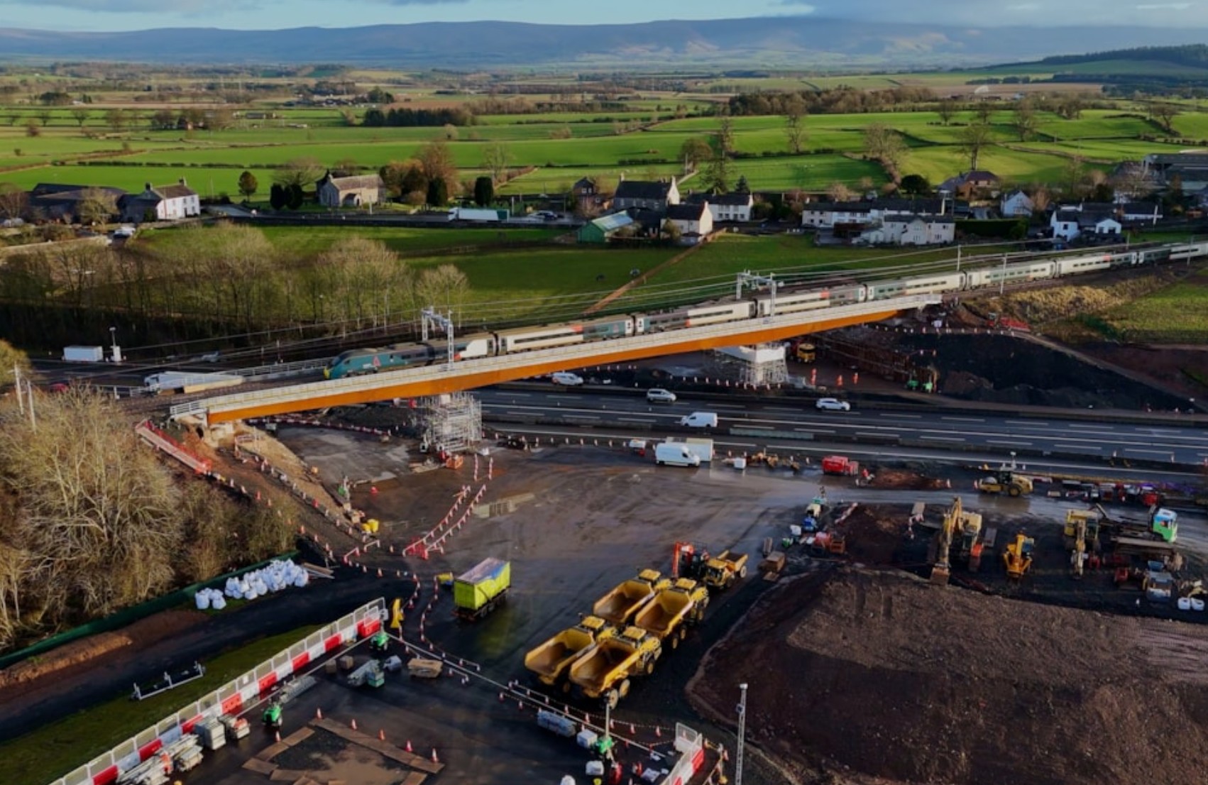 First trains run across new £60m bridge as West Coast Main Line reopens ...